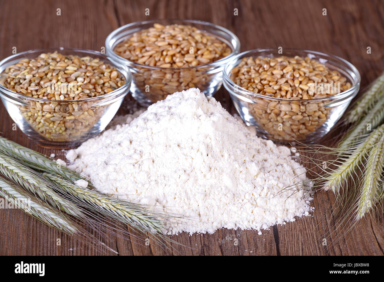 wheat grain and flour close up Stock Photo - Alamy