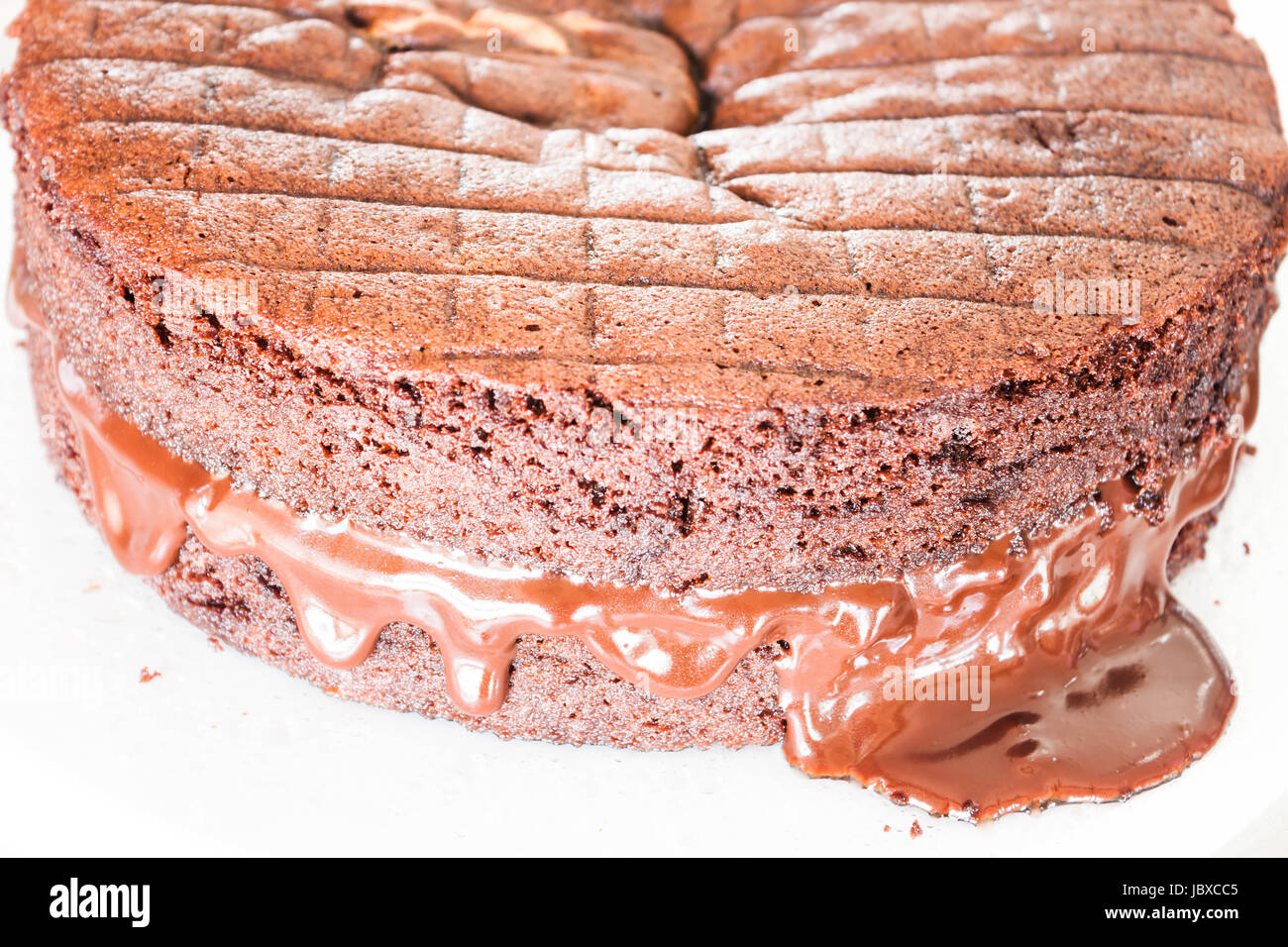 Chocolate fillings melt from chiffon chocolate cake Stock Photo - Alamy