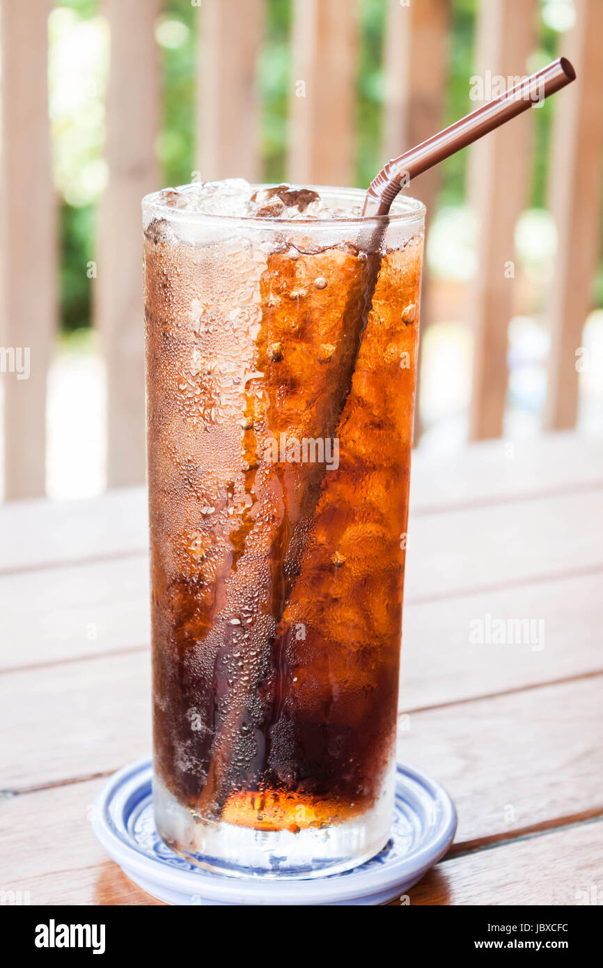 A glass of fresh cola drink with ice Stock Photo - Alamy