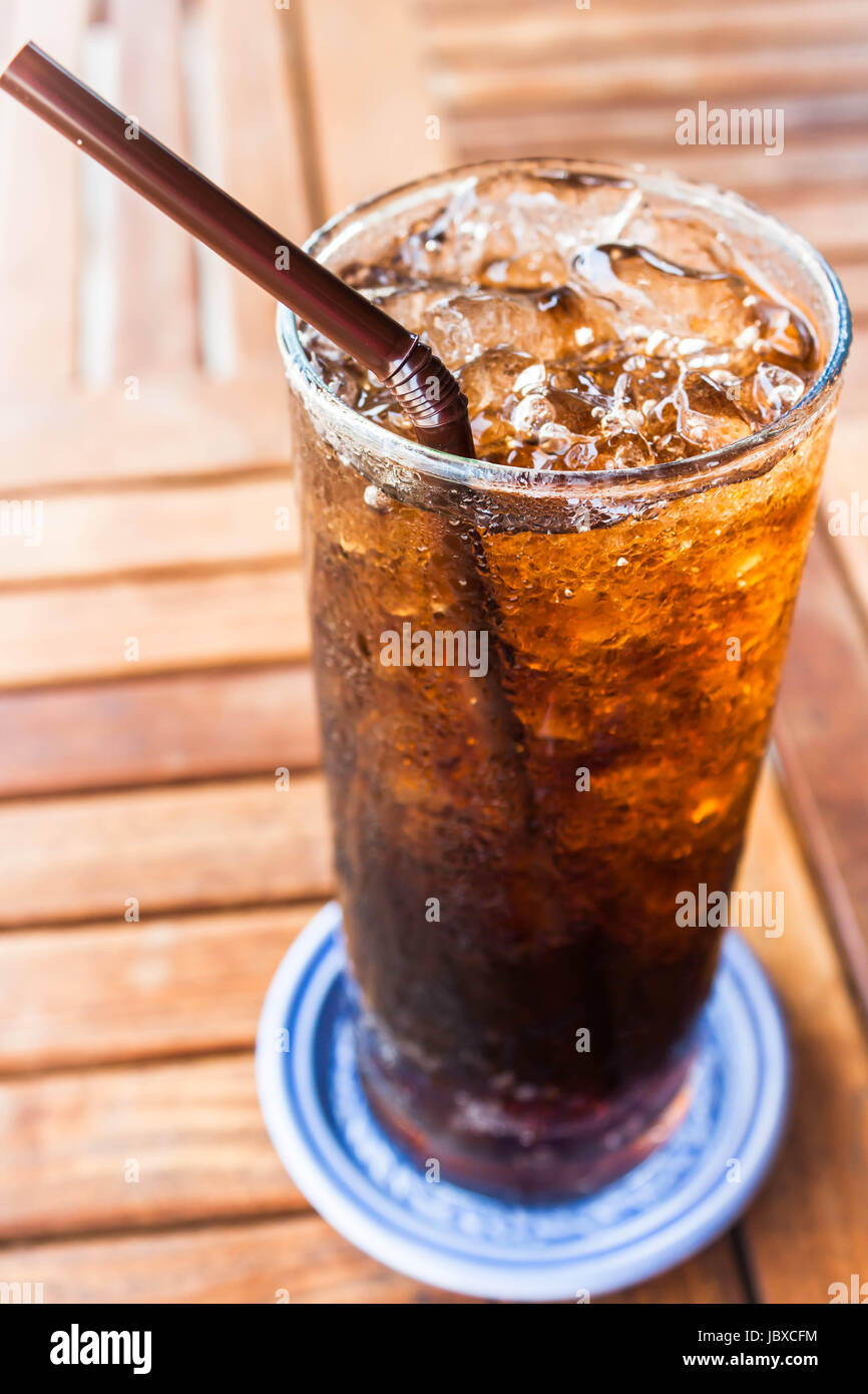 Filled glass with fresh ice cola drink Stock Photo - Alamy