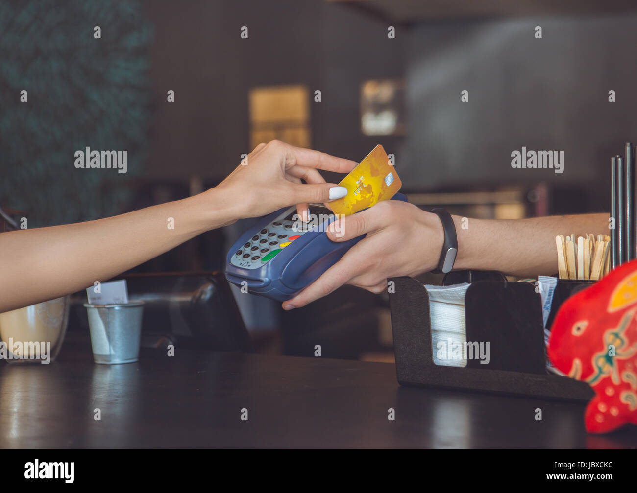 Young female sitting in a cafe indoors rest cashless payment Stock ...