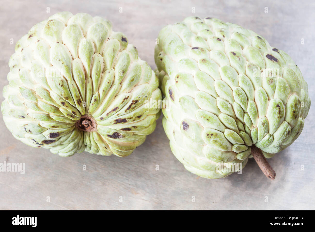 Couple fresh custard apple on gray background Stock Photo - Alamy