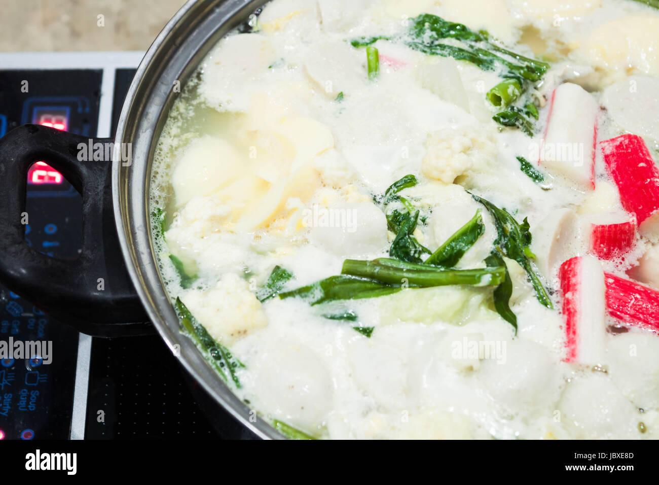 Boiling suki soup in big bowl Stock Photo - Alamy