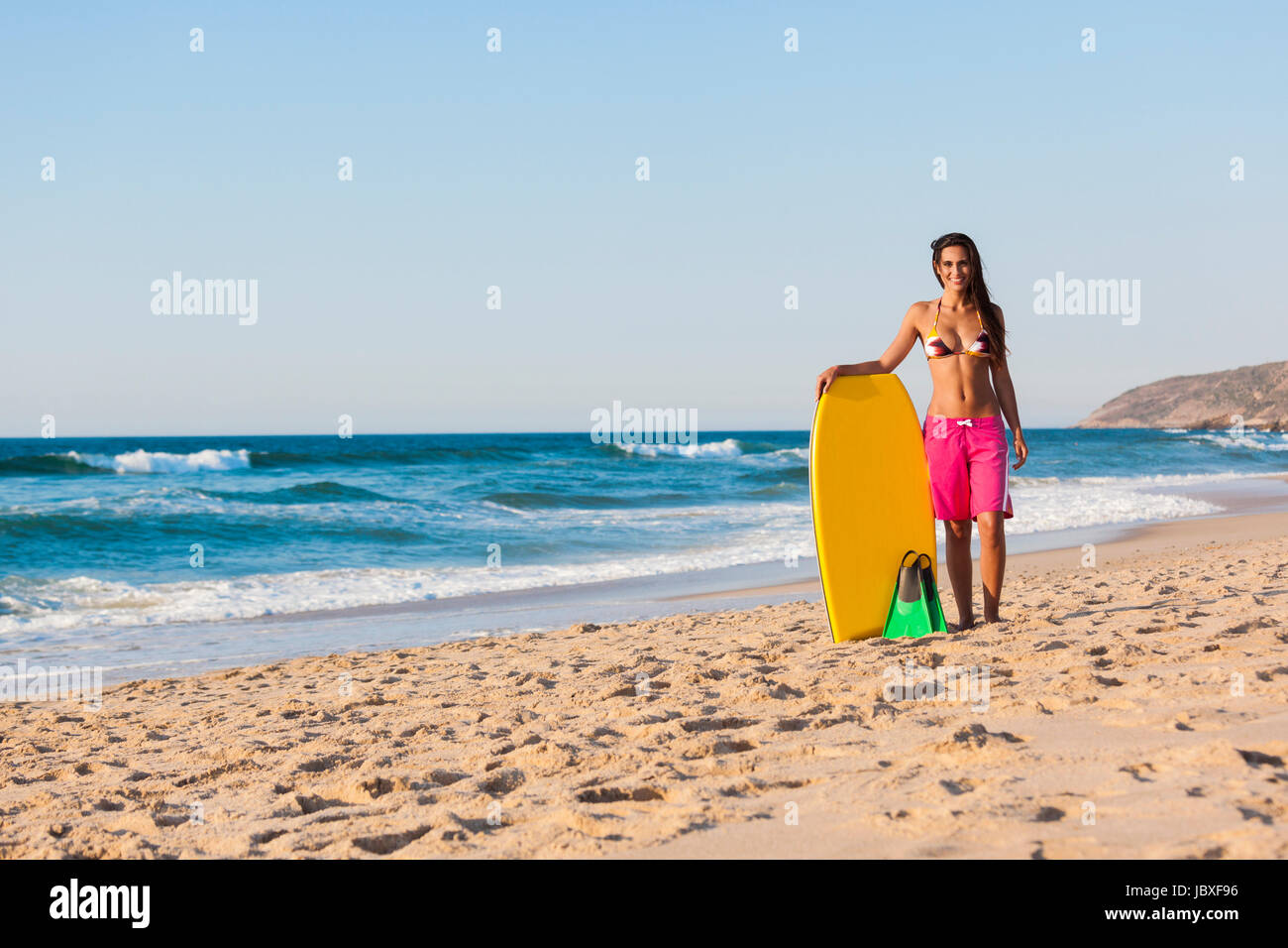 A beautiful girl at the beach with her bodyboard Stock Photo - Alamy