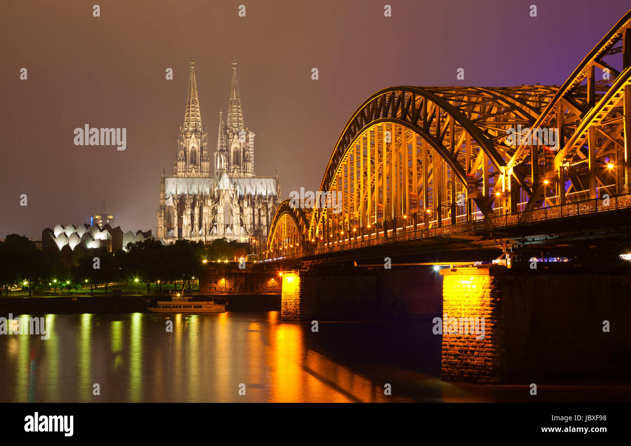 Cathedral and Hohenzollern Bridge at night, Cologne, Germany Stock ...