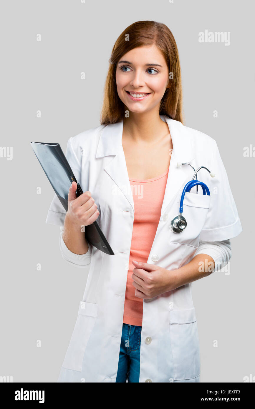 Beautiful and attractive female doctor, isolated over a white ...