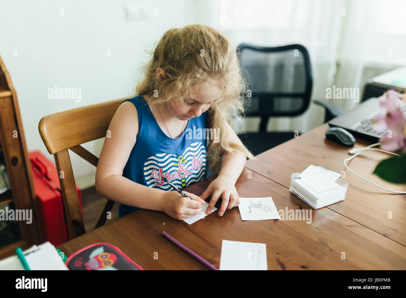 Cute little preschooler child drawing at home Stock Photo - Alamy