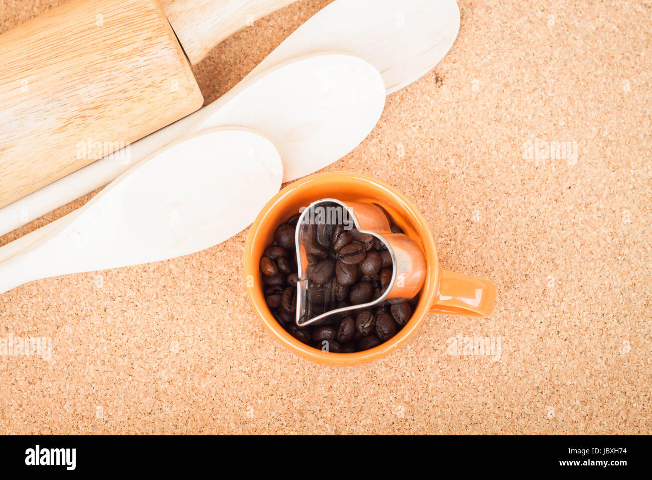 Cup of coffee bean and cookies cutter in kitchen Stock Photo - Alamy