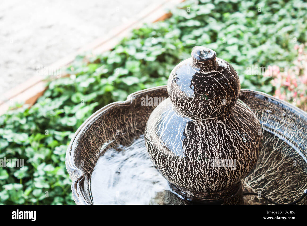 Water spring for garden ornament Stock Photo - Alamy