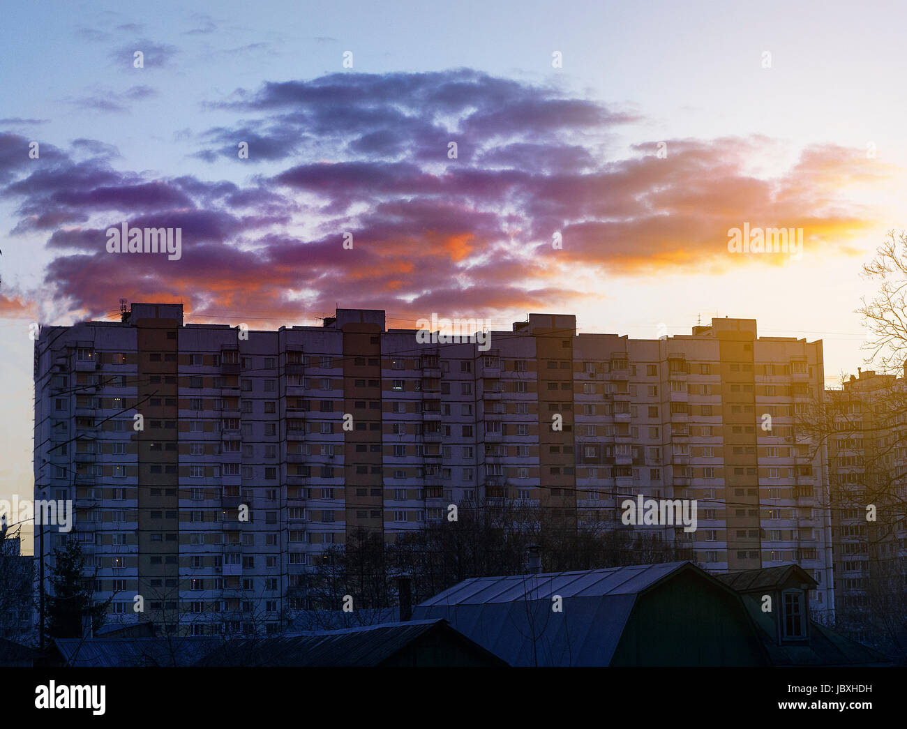 Apartment building at sunset block of Stock Photo - Alamy
