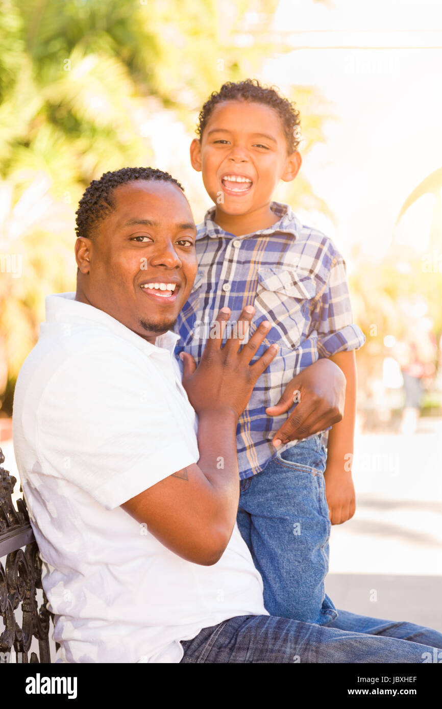 Mixed Race Son And African American Father Playing Outdoors Together
