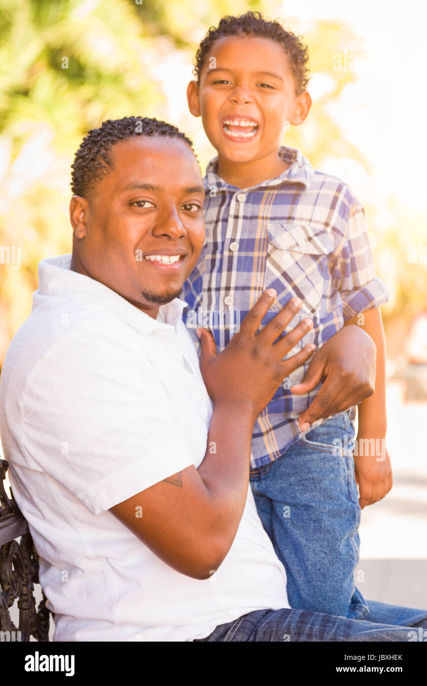 Mixed Race Son and African American Father Playing Outdoors Together ...