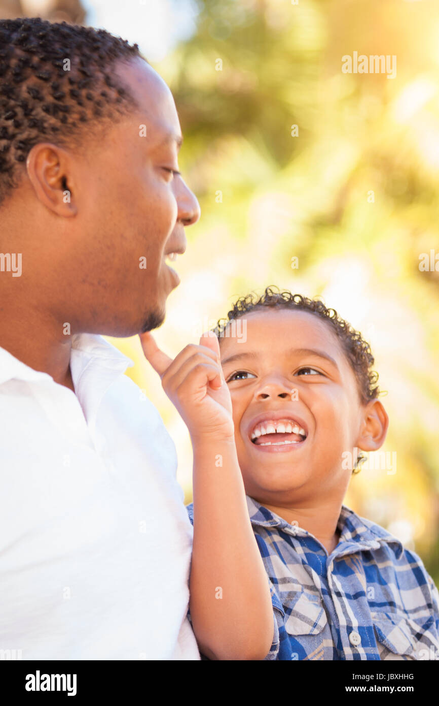 Mixed Race Son And African American Father Playing Outdoors Together
