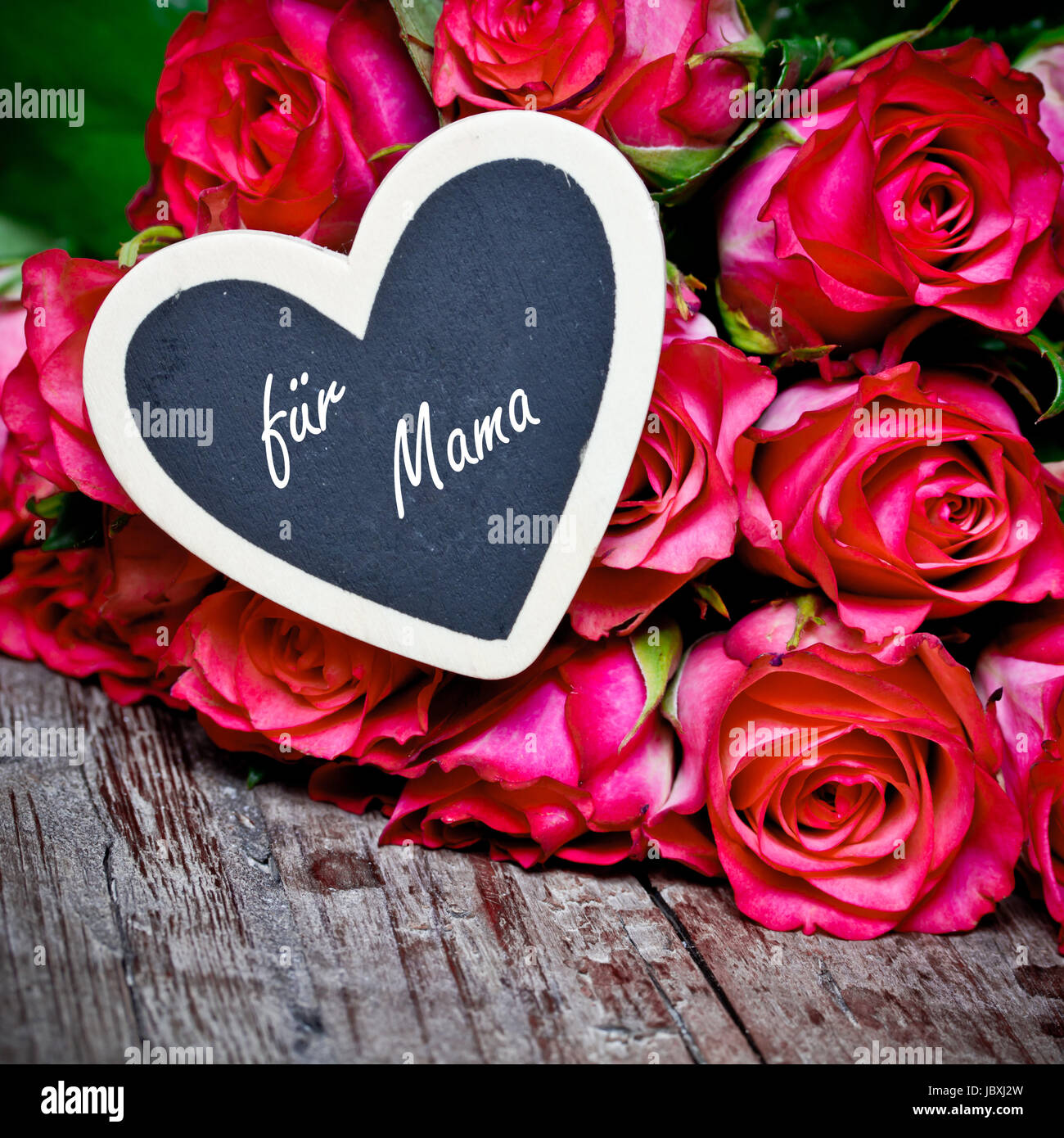 red roses as a gift Stock Photo - Alamy