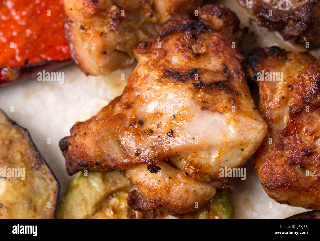 Mixed grilled meats platter with vegetables. Macro. Photo can be used ...