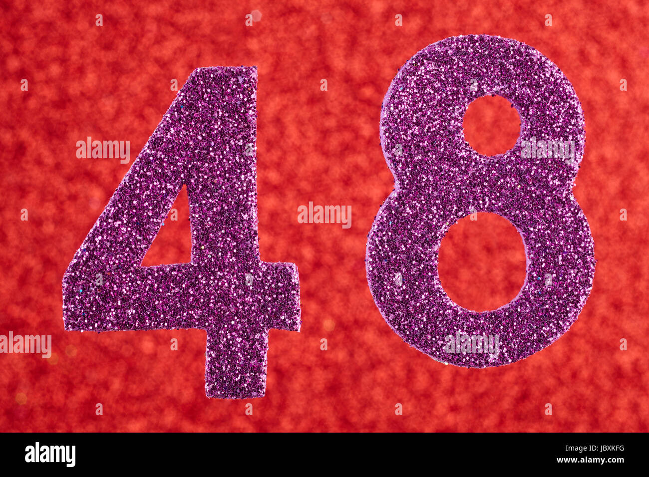 Number forty-eight purple color over a red background. Anniversary ...