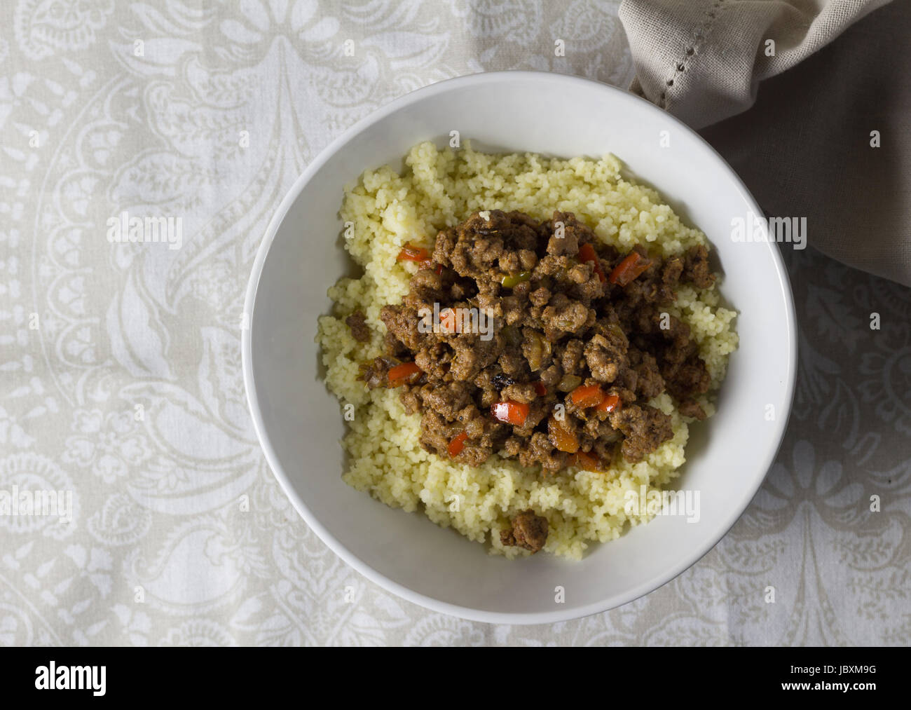 Couscous with meat and red peppers Stock Photo - Alamy
