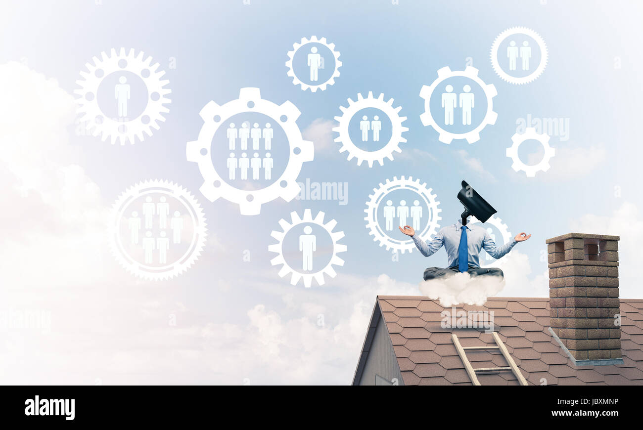 Faceless businessman with camera zoom instead of head sitting in lotus ...