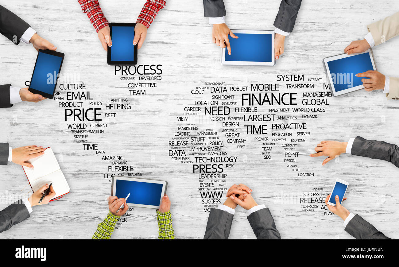 Group of people with devices in hands working together as symbol of ...