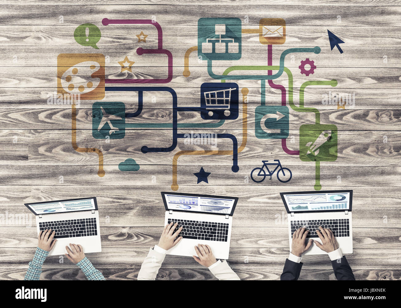 Group of three people with devices in hands working together as symbol ...