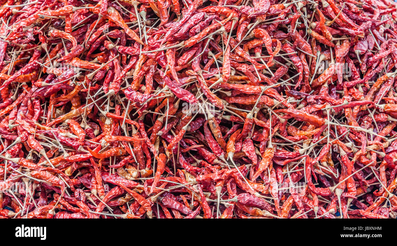 Dried red pepper on display at local market Stock Photo - Alamy