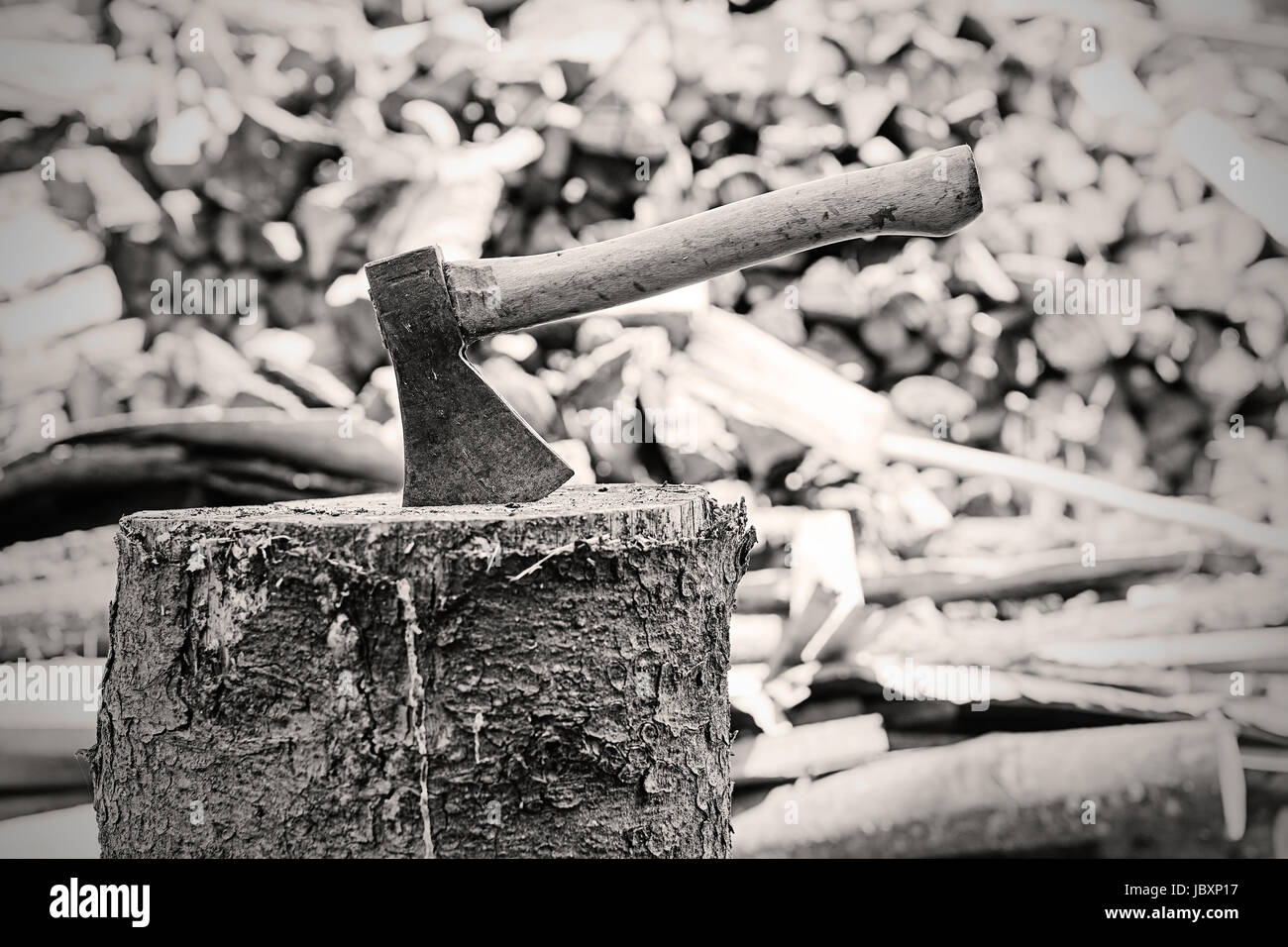 Axe in the stump Stock Photo - Alamy