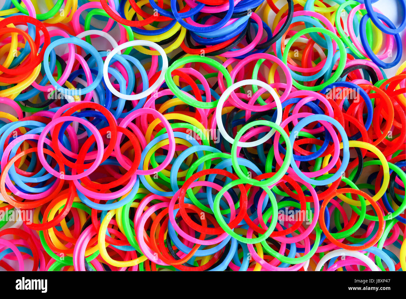 colorful background rainbow colors rubber bands loom Stock Photo - Alamy