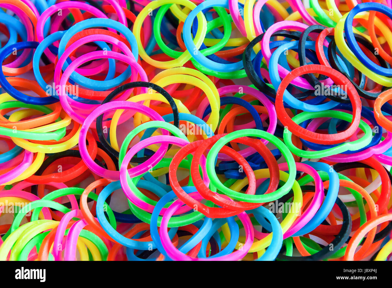 colorful background rainbow colors rubber bands loom Stock Photo - Alamy