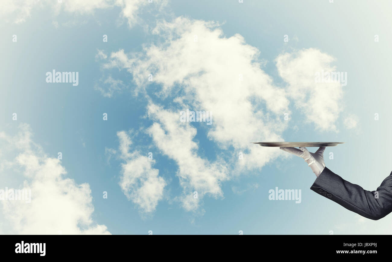 Butler hand in white glove presenting empty tray Stock Photo - Alamy