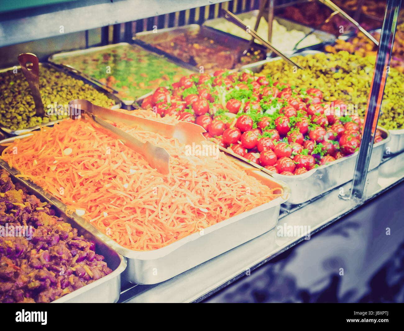 Vintage retro looking Take away food shop with vegetables, carrots and ...
