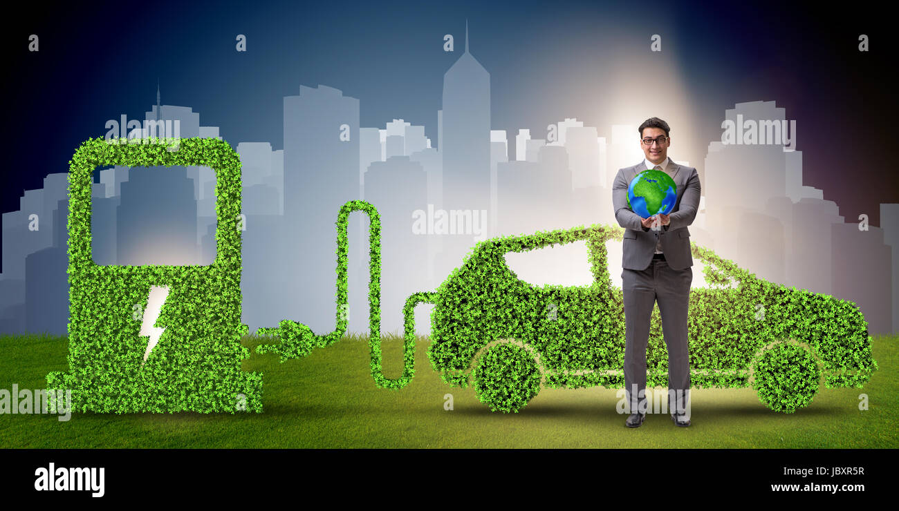 Electric car concept in green environment concept Stock Photo - Alamy
