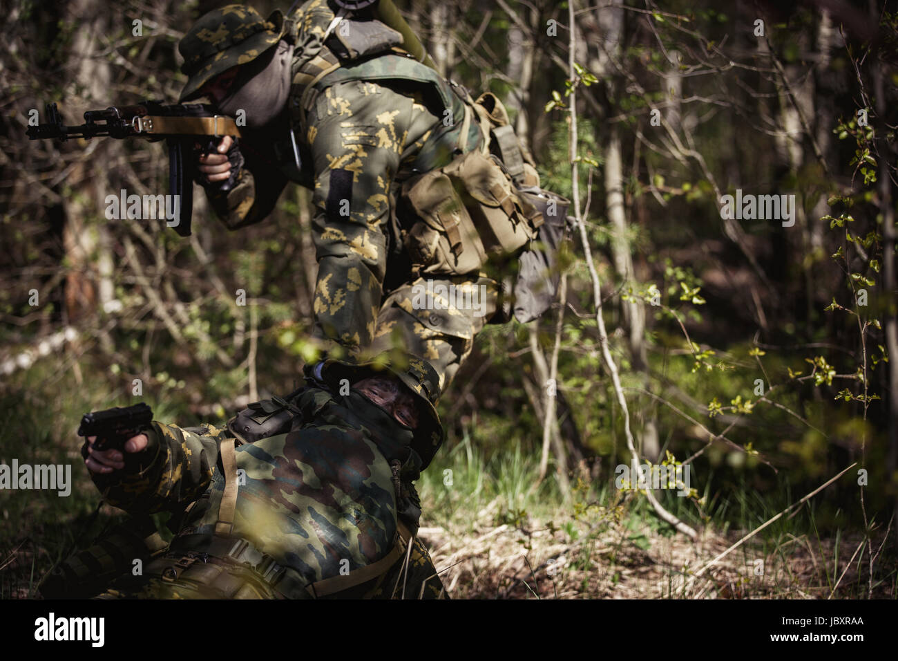 The soldier saves his comrade in battle Stock Photo - Alamy