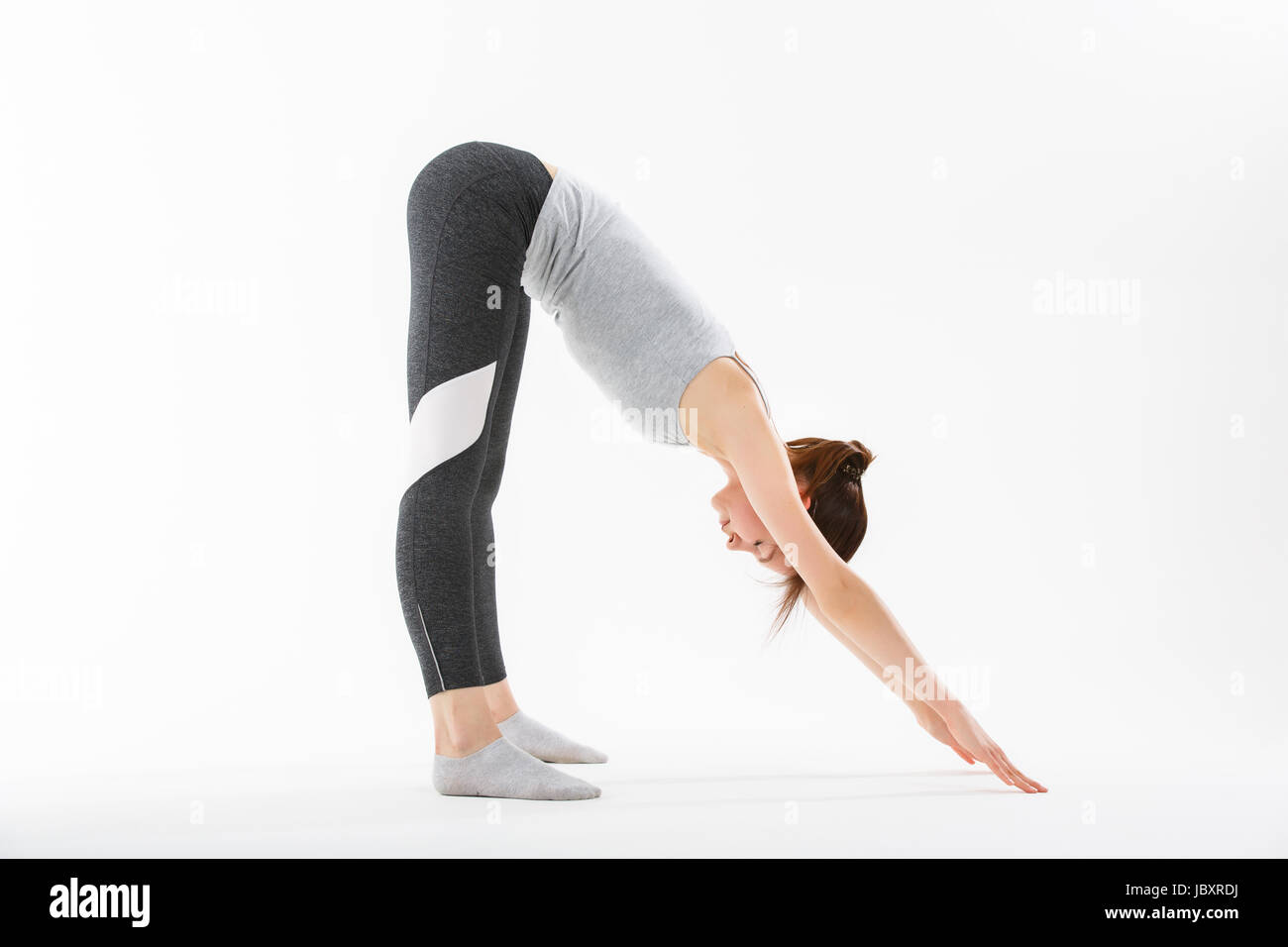 Young woman exercise yoga supported headstand Stock Photo - Alamy