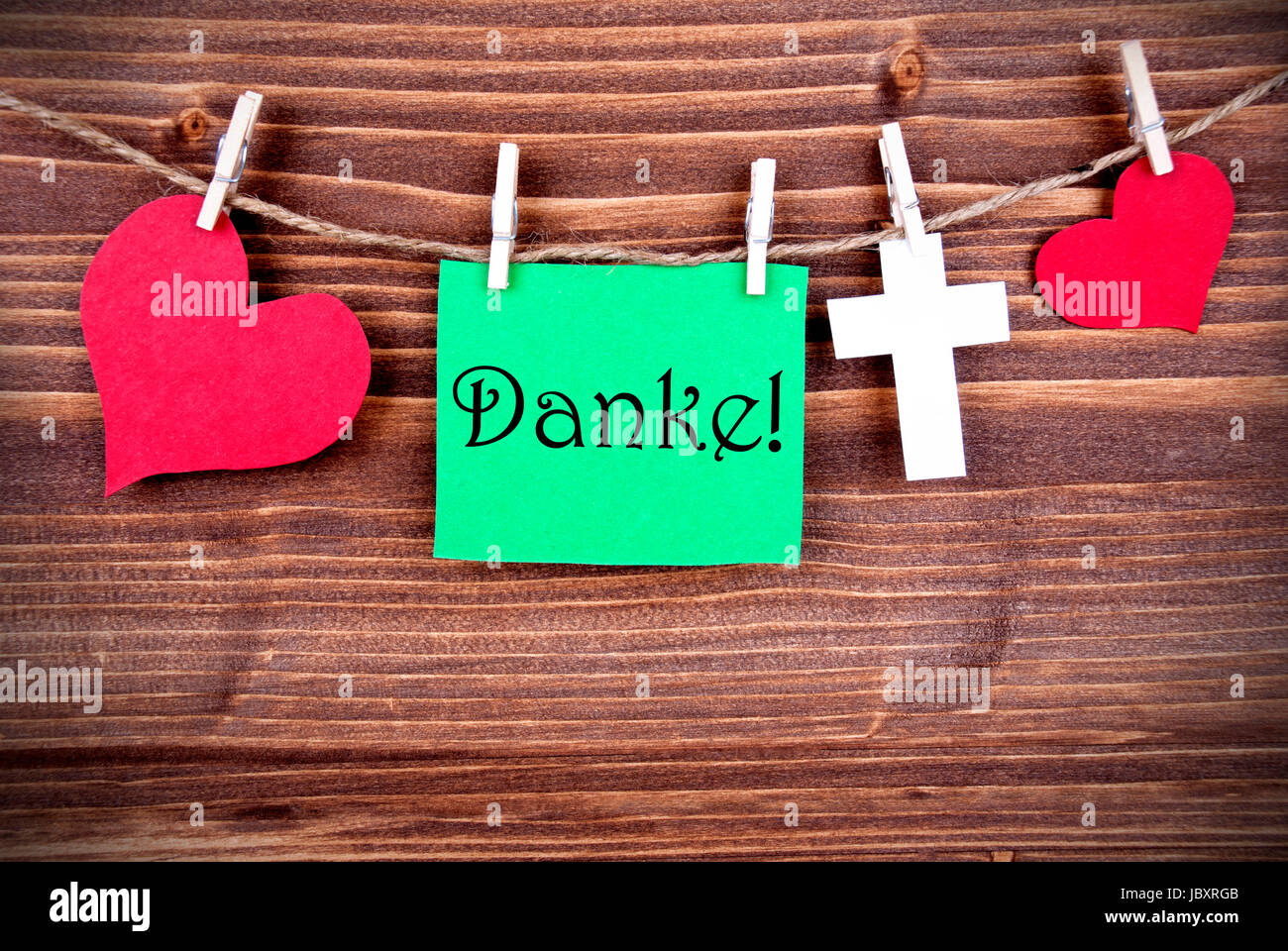 Green Tag with Hearts and Cross on a Line with the German Word Danke ...