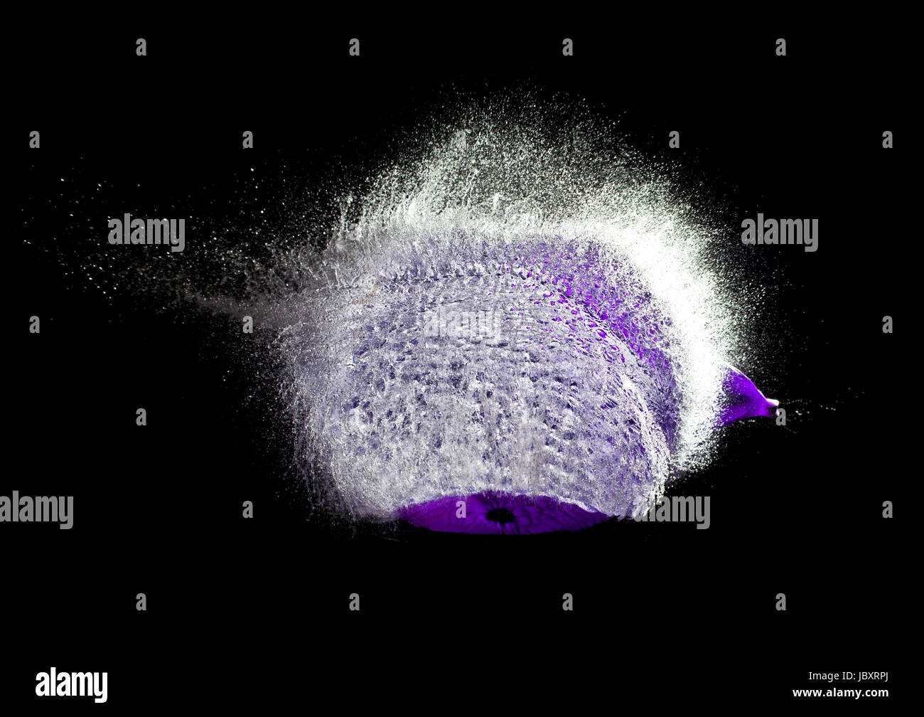 Explosion balloon full water high hi-res stock photography and images ...