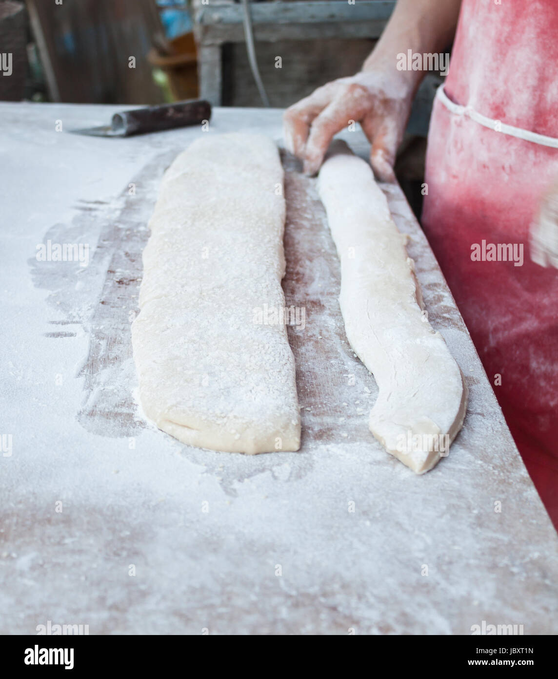 Threshing and cutting flour of deep fried dough stick Stock Photo - Alamy