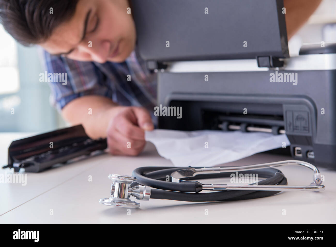 Repairman repairing broken color printer Stock Photo - Alamy