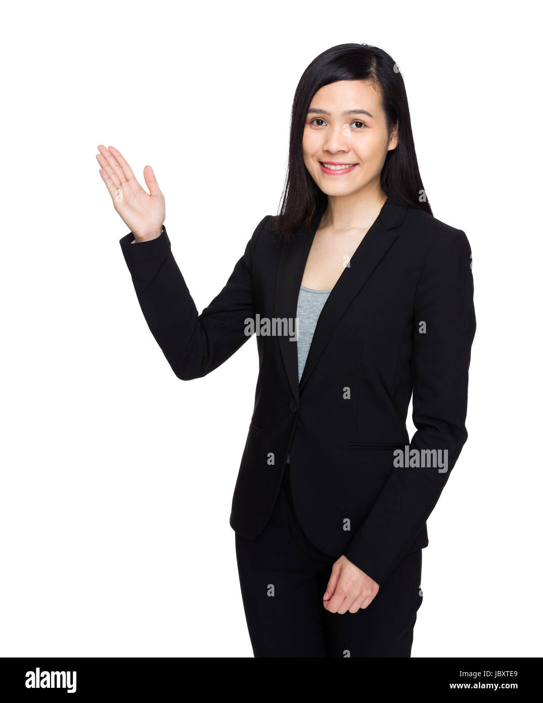 Business woman with hand presentation Stock Photo - Alamy