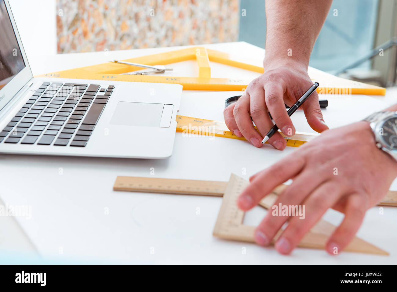 Male engineer working on drawings and blueprints Stock Photo - Alamy