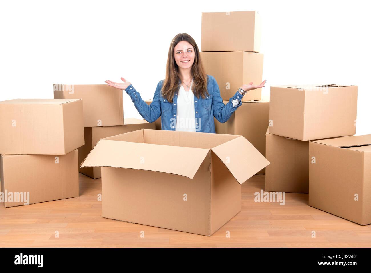 Beautiful girl with cardboard boxes unpacking in new home Stock Photo ...