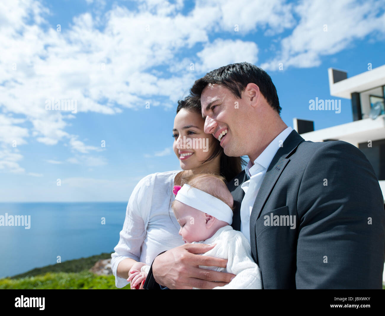 happy young family couple with beautiful new born baby have fun at ...