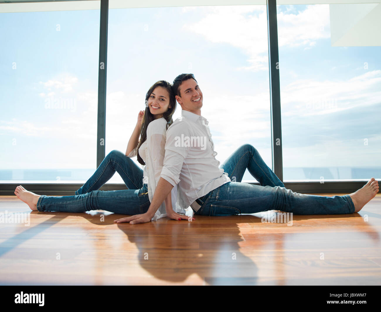 romantic happy young couple relax at modern home indoors Stock Photo ...