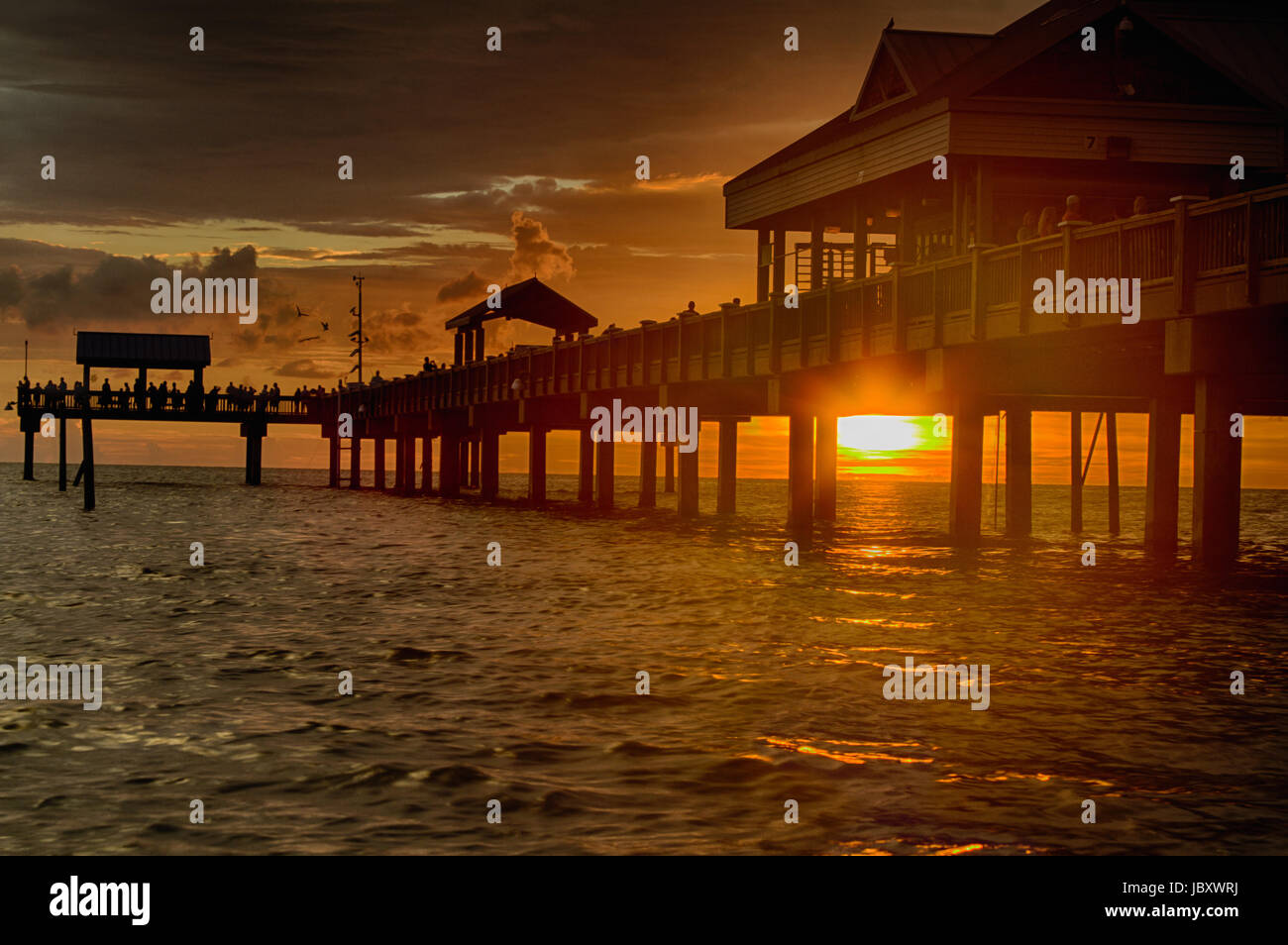 Sunset at the pier Stock Photo - Alamy