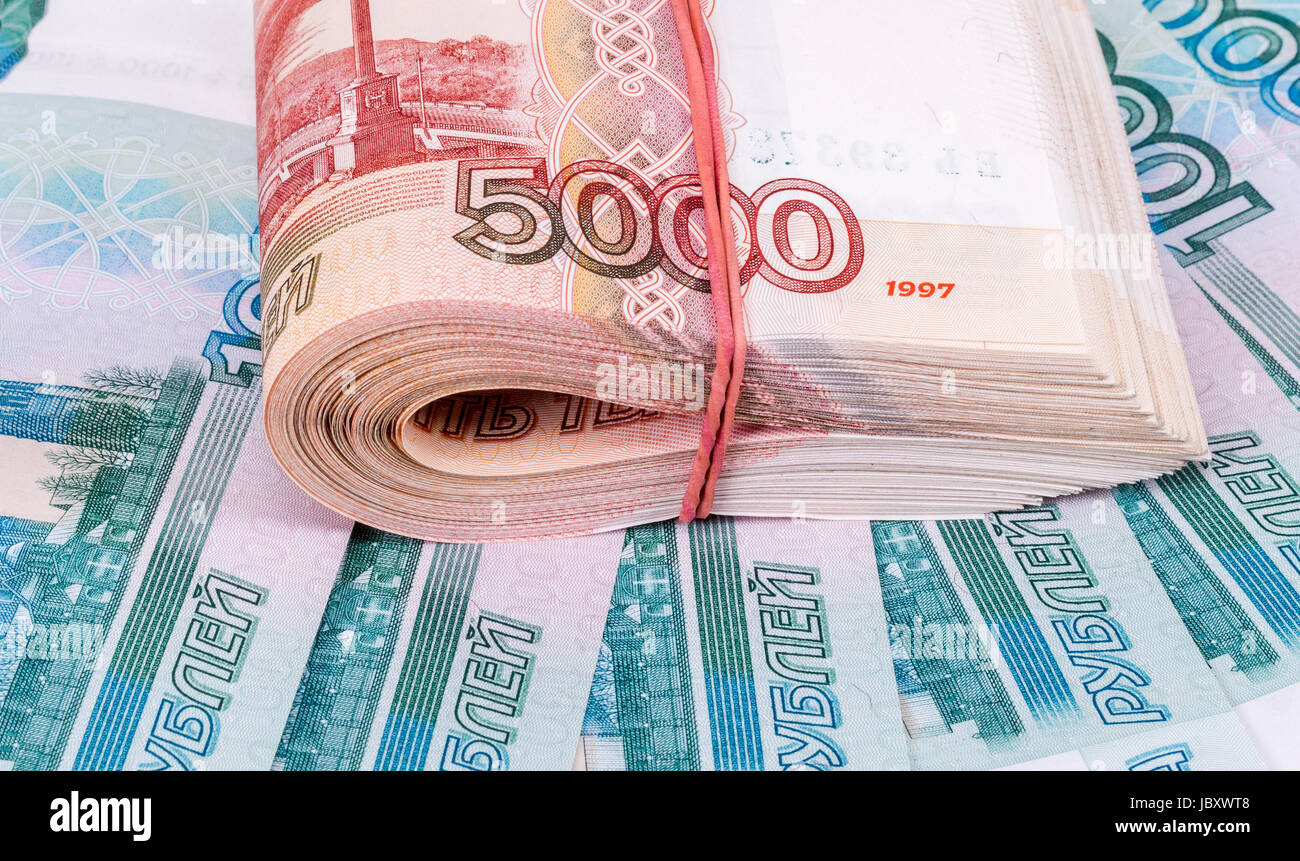 Folded stack of five thousandths banknotes of russian roubles on money ...