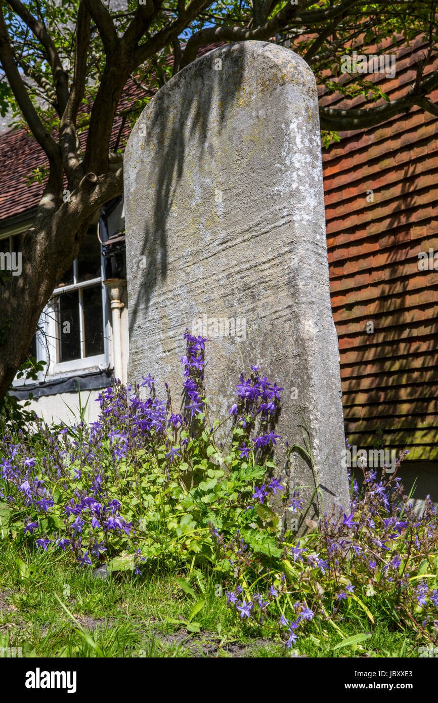An old gravestone in a quaint English churchyard Stock Photo - Alamy