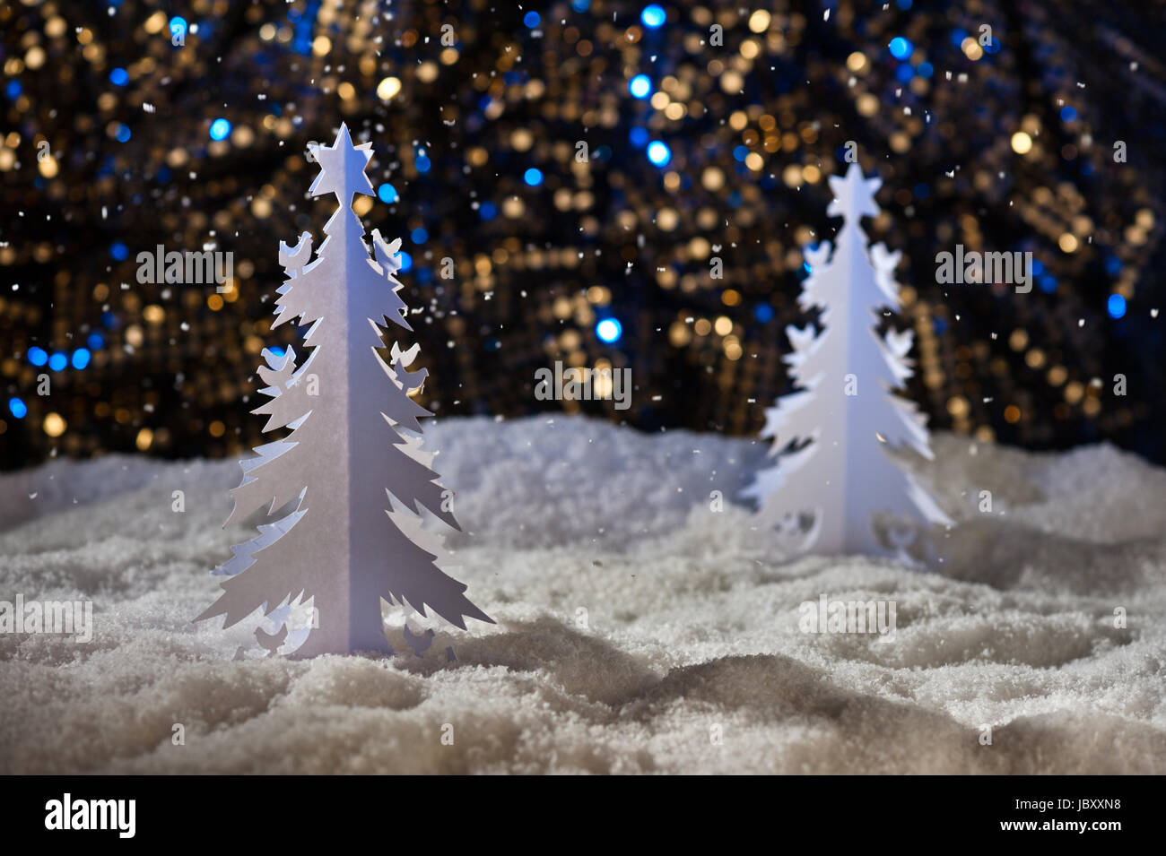 Paper cut christmas tree in snowy winter wonderland Stock Photo - Alamy
