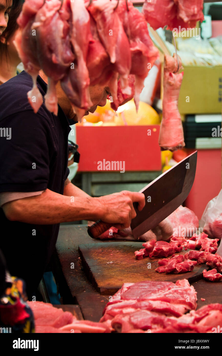 Man chopping meat at meat market hi-res stock photography and images ...