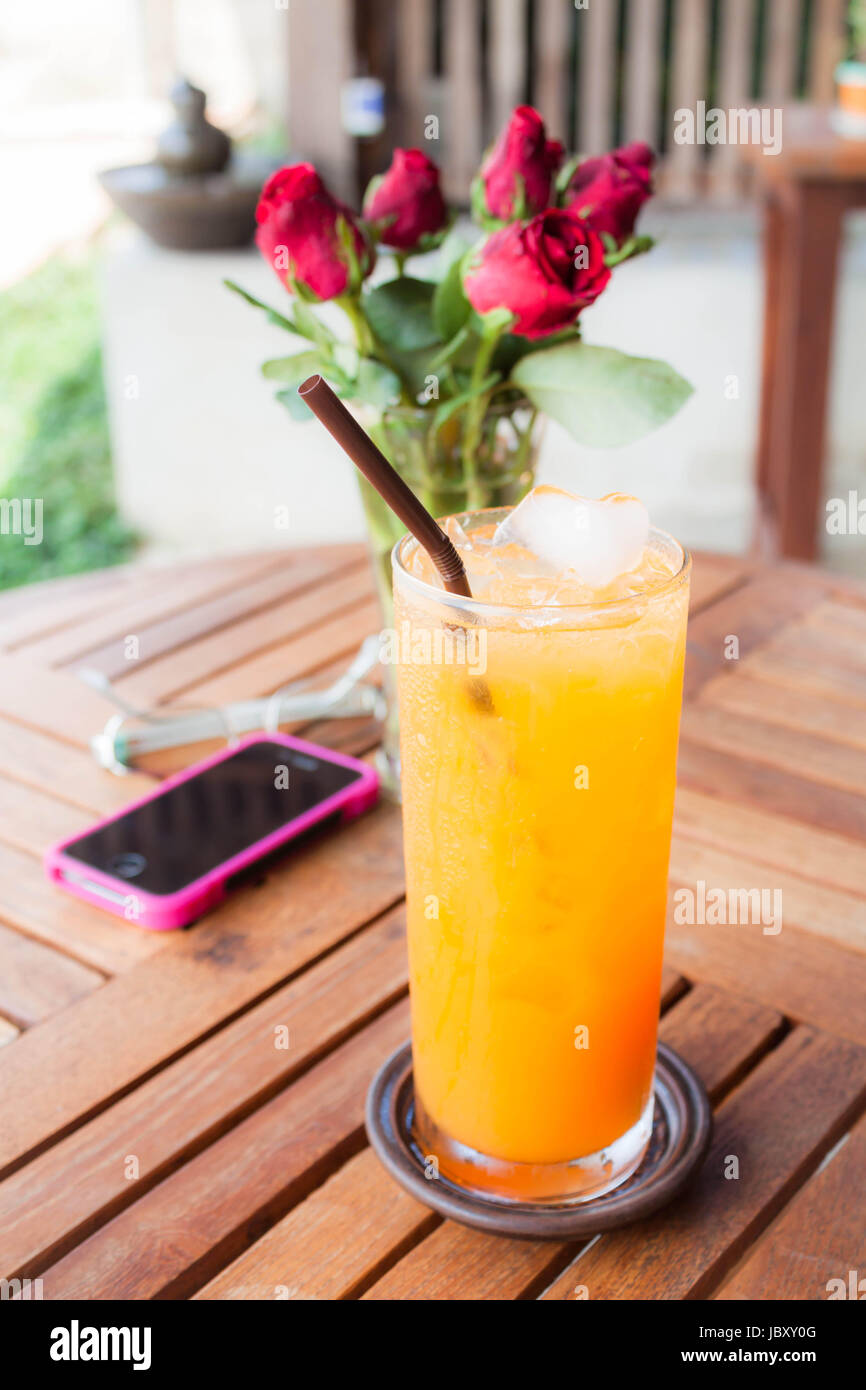Relaxing time with fresh iced orange juice Stock Photo - Alamy