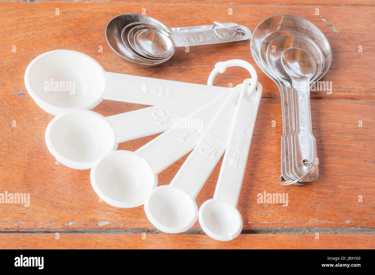 Many types of bakery measuring spoons on wood table Stock Photo - Alamy