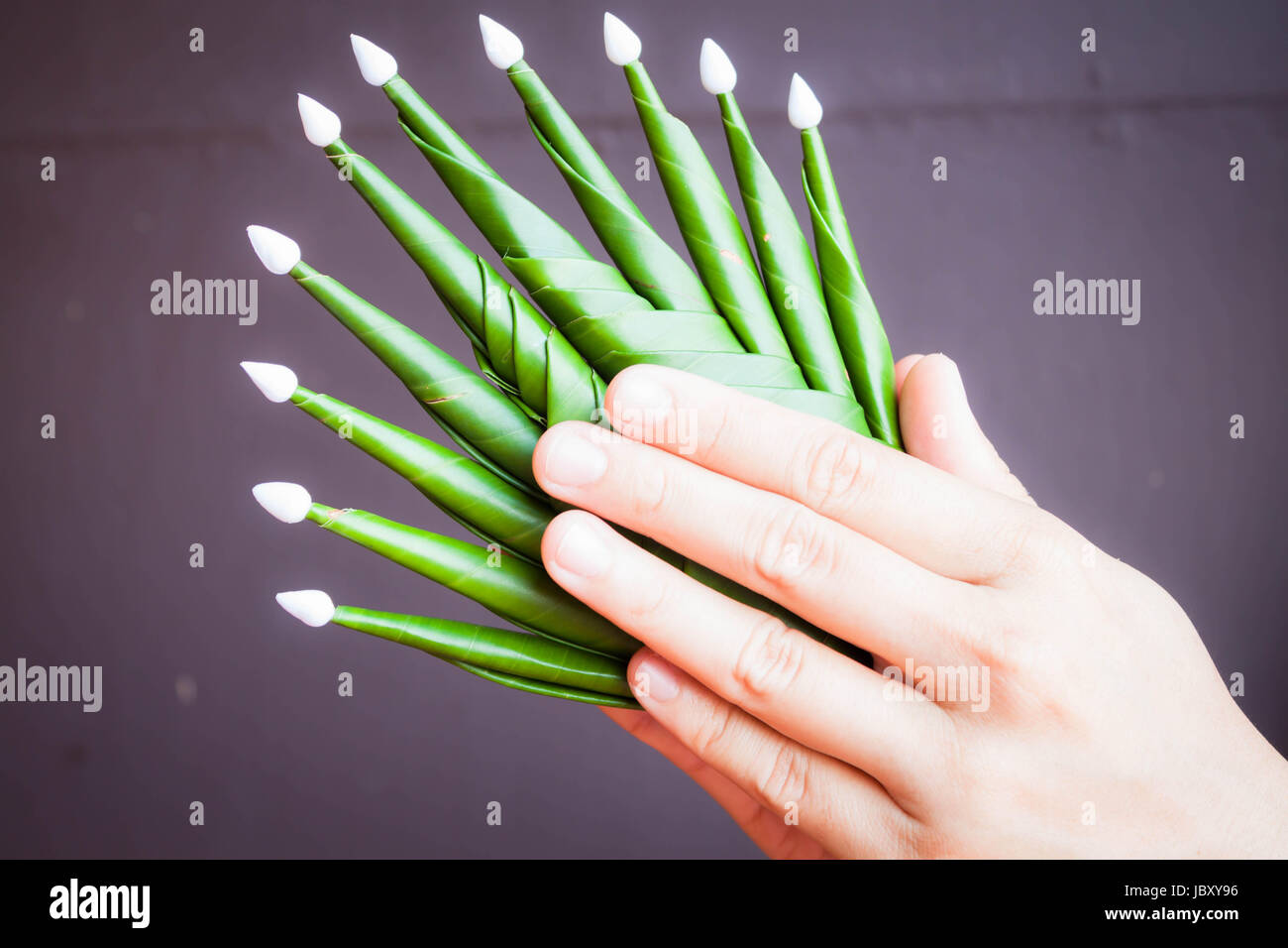 Hands worship a part of rice offering Stock Photo - Alamy